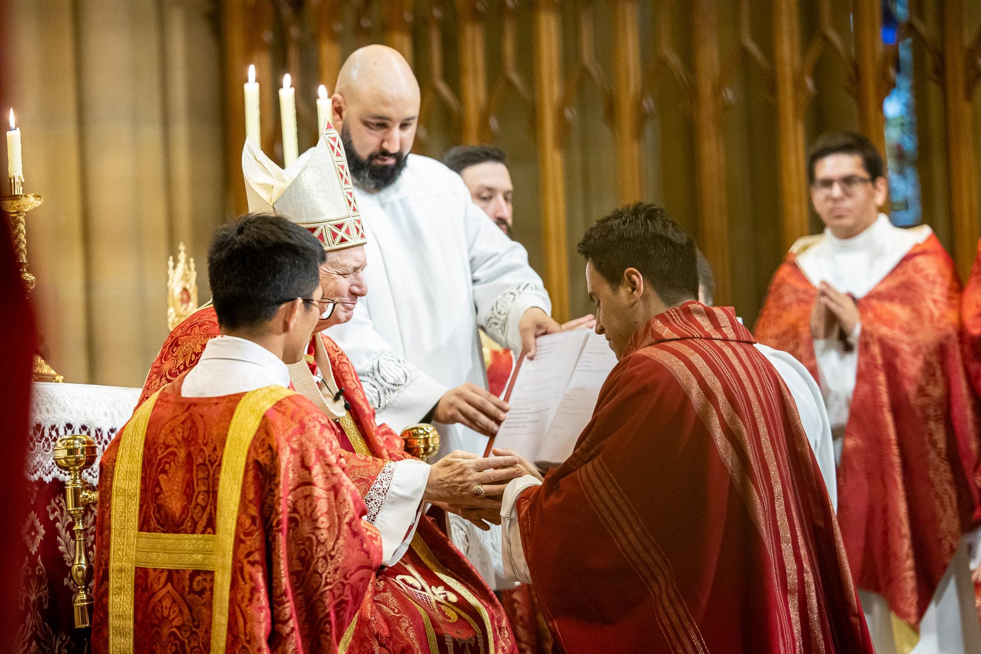 Archbishop FIsher OP anoints the hands of Fr Alejandro: Alphonsus Fok.